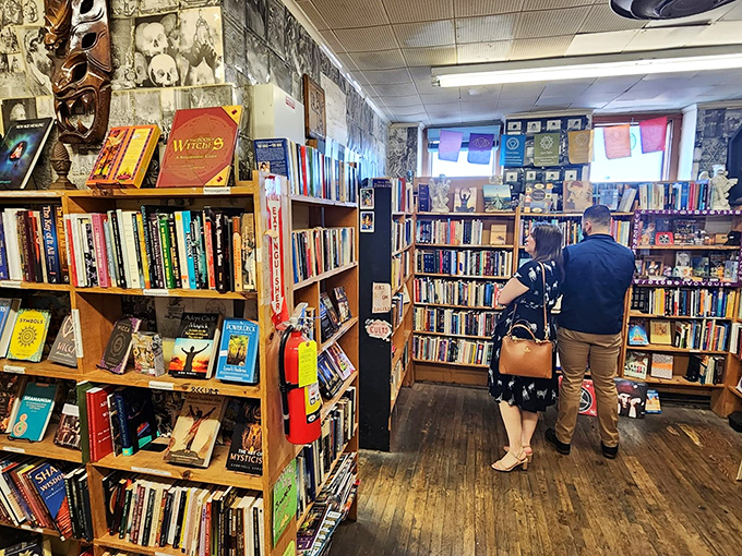 Lost in the stacks of satisfaction! Customers browse the aisles, their faces a mix of concentration and joy – the universal language of book lovers.