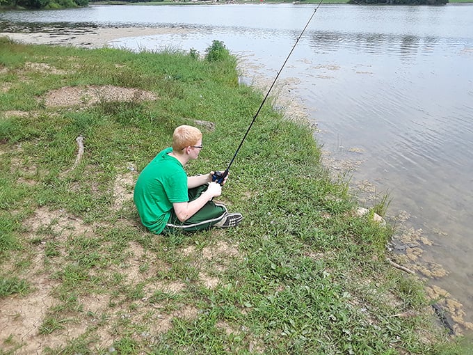 Gone fishin' and living the dream! This angler knows the secret to happiness: a quiet lake, a fishing rod, and endless patience.
