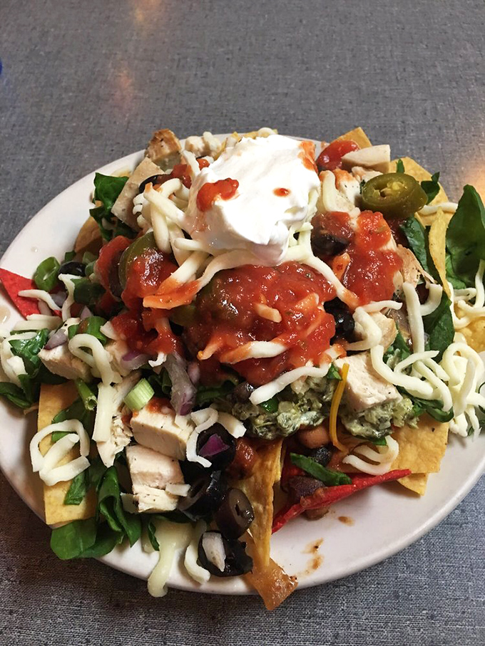 Nacho average appetizer! These goat cheese and spinach nachos are a gourmet twist on a classic favorite.