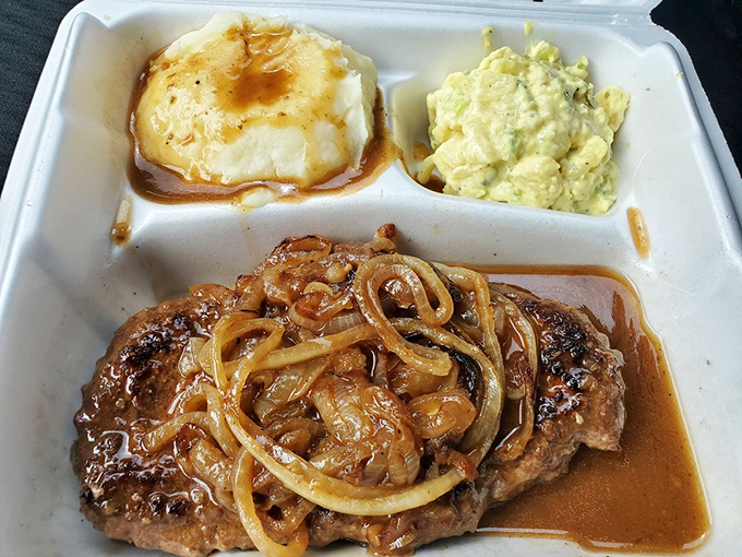 Steak your claim on this beauty! Smothered in onions and gravy, it's comfort food that hugs you from the inside out.