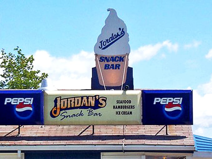 Ice cream dreams and seafood schemes! This sign promises a trifecta of Maine's finest: seafood, burgers, and frozen treats.