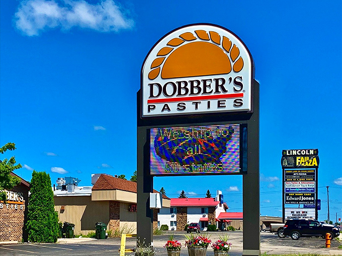 The beacon of baked goodness! This sign is like a lighthouse, guiding hungry souls to their flaky destiny.