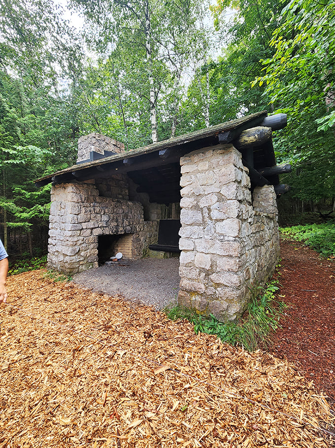 Stone shed chic: Rustic luxury at its finest. The perfect spot for a squirrel's summer getaway or a hiker's pit stop.