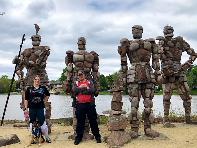 "Man's best friend meets man-made marvels. This pup's probably wondering if these big guys have any treats."