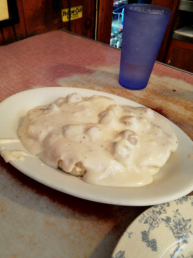 Biscuits and gravy: the South's gift to comfort food. This plate isn't just breakfast; it's a warm, creamy hug for your taste buds.
