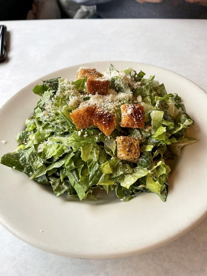 Who said you can't be healthy at a pizza joint? This Caesar salad is crisp, tangy, and the perfect warm-up act for the main pizza event.