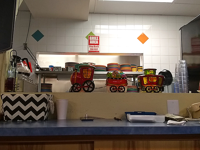 Behind this counter, culinary magic happens. It's like watching a short-order cook ballet, but with more bacon grease and less tutus.