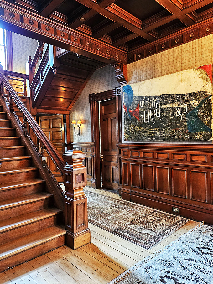 Art that makes you look twice and decor that makes you want to redecorate. This stairway is an Instagram story waiting to happen.