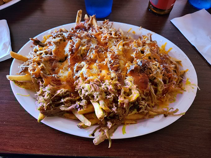 Fries, glorious fries! Topped with enough pulled pork to make a vegetarian weep with envy.
