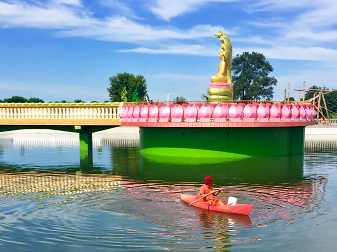 Paddle your way to peace! This serene pond offers a unique perspective on cultural immersion.