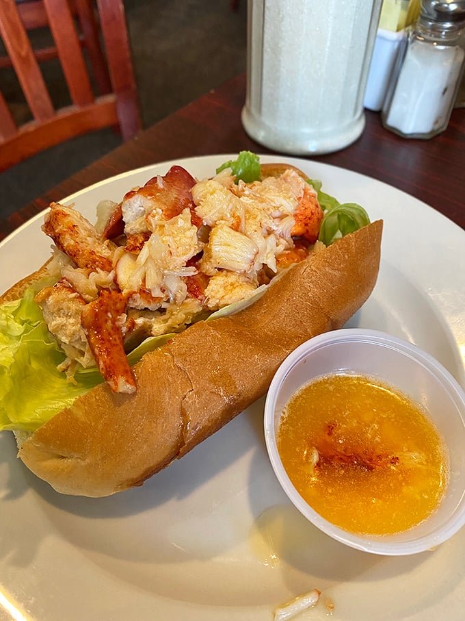 Lobster roll heaven! This sandwich is packed with so much seafood goodness, it's practically a love letter from the ocean.