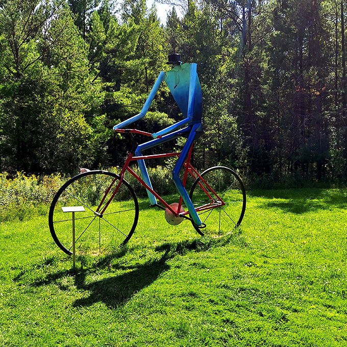 "On your mark, get set, pedal!" This larger-than-life cyclist seems ready to race through the forest, leaving a trail of wonder behind.