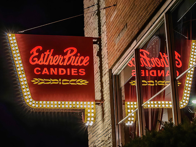 Lights, camera, confection! Esther Price's retro sign glows like a Vegas marquee, promising a jackpot of sweetness inside.