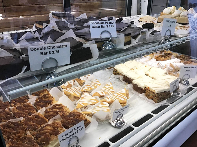 A rainbow of sweet temptations! This pastry case is like a treasure chest for your taste buds. X marks the spot!