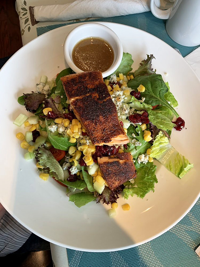 Not just a salad, but a colorful canvas of flavors. Topped with perfectly seared fish, it's proof that healthy eating can be a joyous affair.