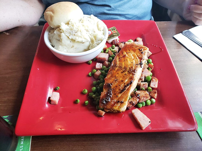 Salmon that swam upstream and landed on cloud nine: Perfectly grilled and perched atop a colorful medley, this dish is a feast for the eyes and palate.