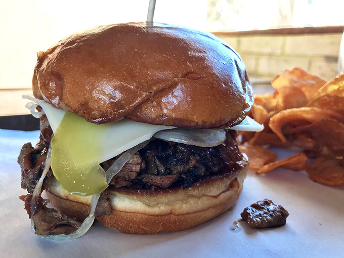 The "Leaning Tower of Meat-sa." This sandwich defies gravity and common sense, but your taste buds will thank you for the adventure.