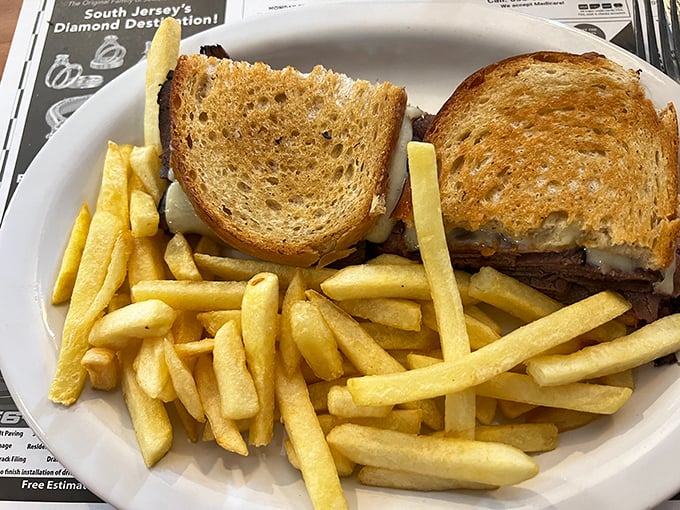 The classic diner sandwich: a testament to the belief that anything between two slices of toast is fair game for breakfast. Bonus points for the crispy fries!