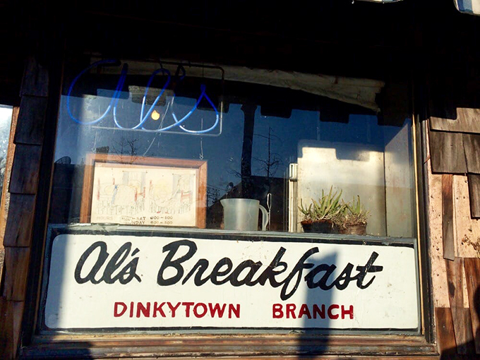 The sign says "Al's Breakfast," but it might as well say "Portal to Flavor Town." Prepare for a tasty adventure!