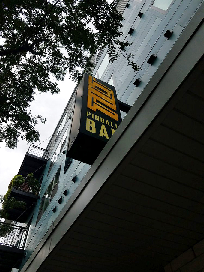 The LITT sign, a beacon of hope for those seeking refuge from the ordinary. It whispers, "Come in, the fun is waiting."