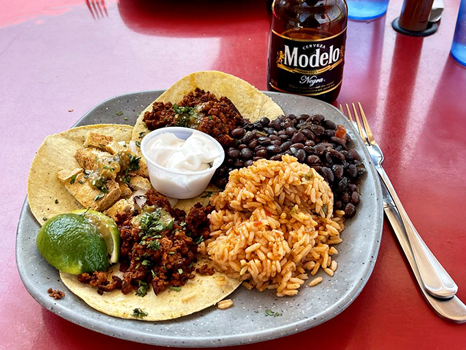 Taco 'bout a perfect plate! This colorful spread is like a Mexican flag made edible, with a Modelo standing guard.