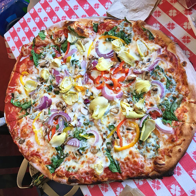 A veggie lover's dream come true! This colorful pie proves that vegetables can party just as hard as pepperoni.