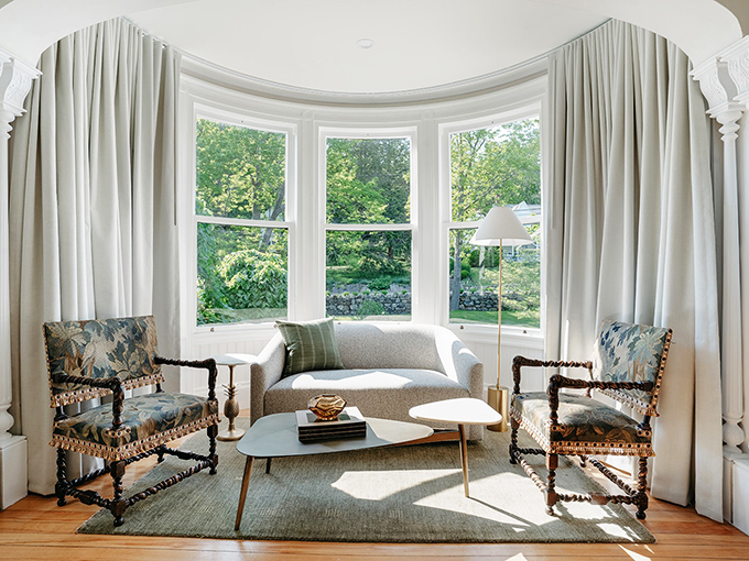 Bay window bliss! This sunny nook is begging for a lazy Sunday morning with coffee, crosswords, and zero plans to move.