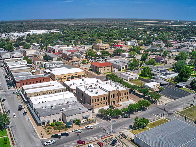 Aerial view: Cuero from above &ndash; where Norman Rockwell meets Google Earth. This bird's-eye view showcases the town's perfect blend of charm and modernity.