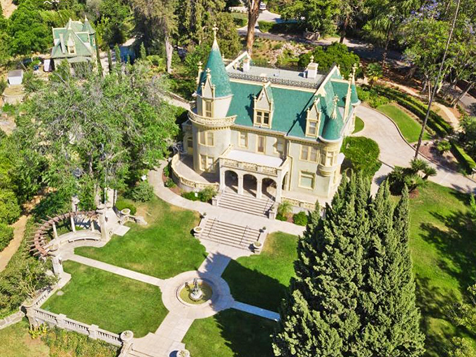 Bird's eye beauty! This aerial shot showcases the mansion in all its geometric glory. It's like a fancy game of Tetris, but with turrets and topiaries.