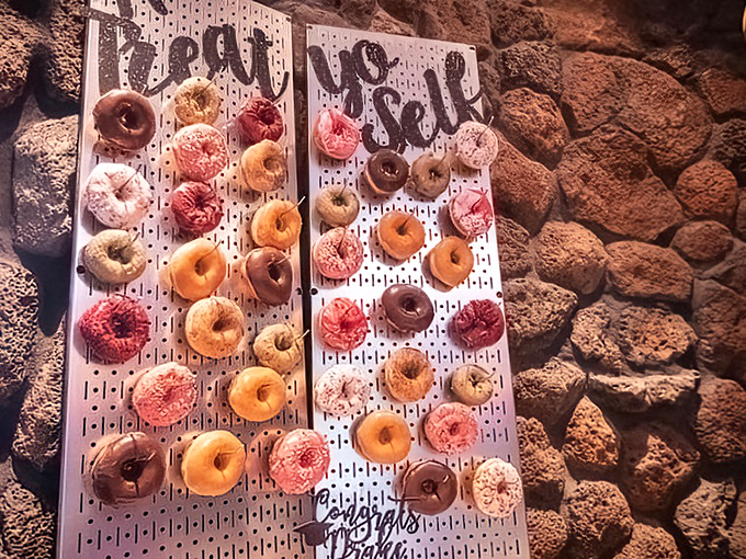 The writing's on the wall... and it's spelling out "YUM!" This donut display is giving museum curators a run for their money.