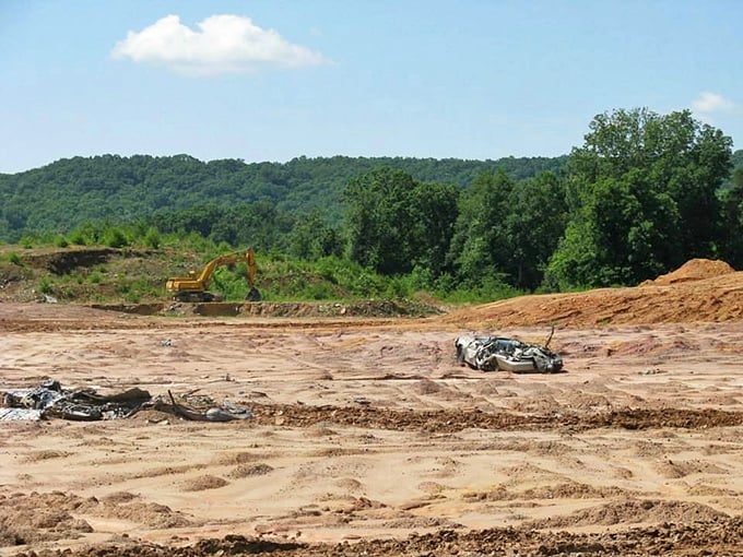 Welcome to Georgia's muddiest dance floor. It's where tanks tango and excavators do the cha-cha with crushed cars.