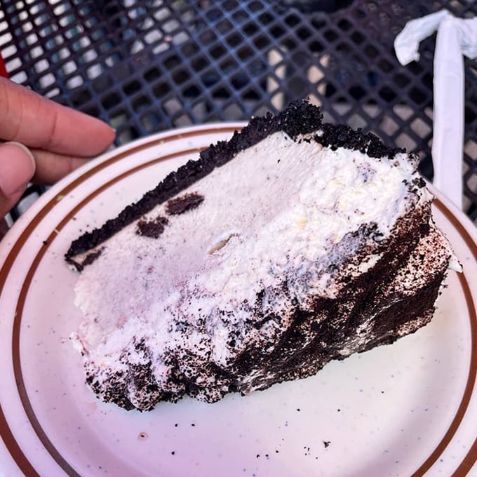 Oreo dreams come true! This slice of heaven is where cookies and cream meet their cloud-like destiny. It's the kind of dessert that makes you wonder why we ever bothered inventing other sweets.
