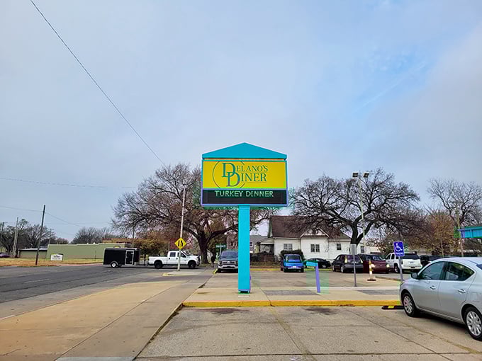 Park your appetite here! Delano's sign promises a feast that'll fuel you up better than any gas station ever could.