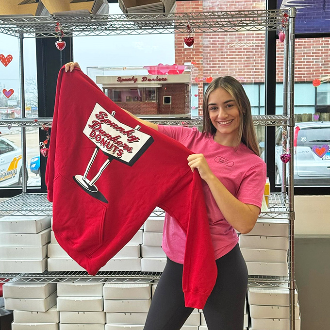 Wear your love on your sleeve &ndash; or your chest! Spunky Dunkers merch: for when eating donuts just isn't enough commitment.