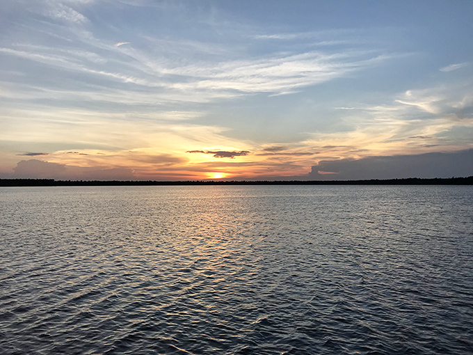 Nature's own light show, no tickets required. This Singletary Lake sunset paints the sky in hues that would make even Bob Ross jealous.