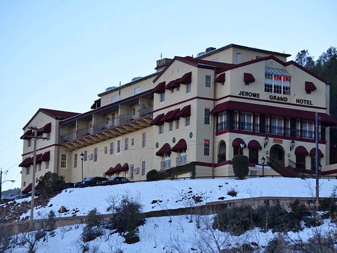 Winter in Jerome: Where snowflakes dance with spirits, and the hotel stands proud against a backdrop of frosty enchantment.