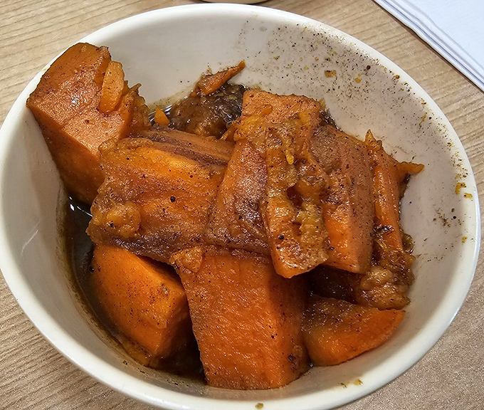 These candied yams are sweeter than hitting the jackpot! A perfect balance of savory and sweet, they're the unsung heroes of Southern sides.