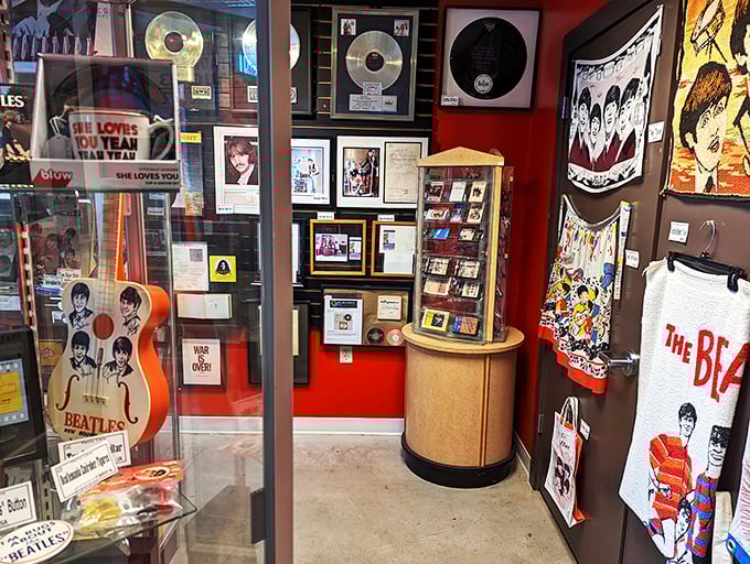 Beatlemania in a bottle... or rather, in a display case! From guitars to gold records, this showcase is a fan's dream come true.