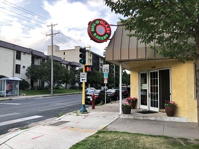 The portal to pastry paradise! Mel-O-Glaze's entrance beckons like a sugary siren song. One step inside, and you'll forget all about that "balanced breakfast" nonsense.