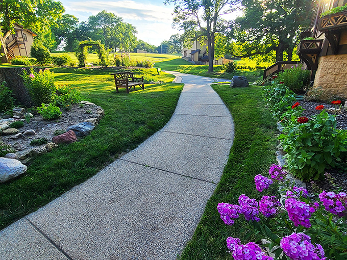 Garden of earthly delights! This path looks like it leads straight into a Monet painting &ndash; impressionist skills not required for enjoyment.