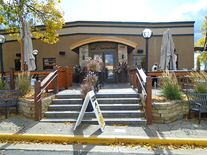 Sun's out, umbrellas up! This patio entrance is ready to welcome you to a world of culinary delights and riverside relaxation.