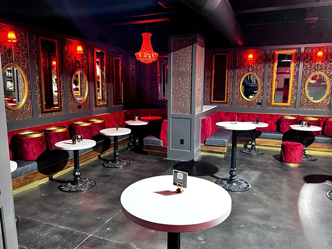 Red velvet dreams and chandelier schemes. This seating area is so posh, it makes me want to practice my British accent.