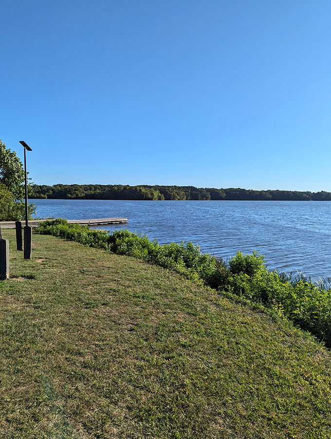 Lakeside bliss! This sun-drenched shore is where "Do Not Disturb" signs come to life. It's the perfect spot to work on your tan - and your ability to do absolutely nothing.