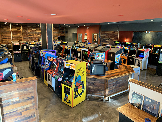 A sea of arcade cabinets as far as the eye can see. It's like Willy Wonka's factory, but replace chocolate with pure, unadulterated fun.