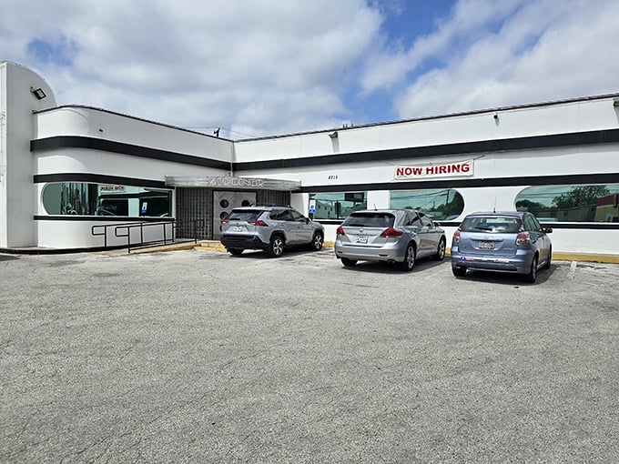 410 Diner: Where time travel comes with a side of fries! This sleek, white exterior screams "1950s sci-fi diner" louder than a jukebox playing "Earth Angel."