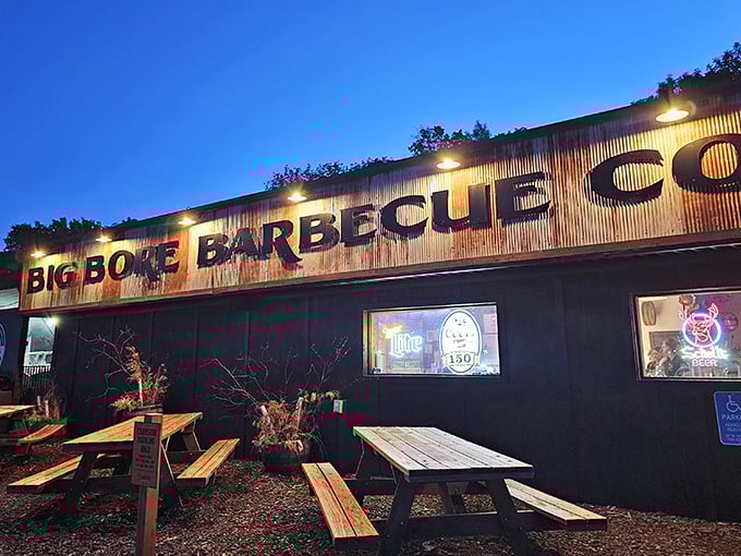 Big Bore's neon sign: a beacon of hope for the hungry and a warning to vegetarians. This corrugated cathedral of carnivorous delights beckons meat lovers from miles around.