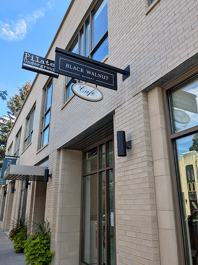 Black Walnut's storefront: Sleek meets sweet! This modern bakery facade promises buttery delights that'll make your taste buds do a happy dance.