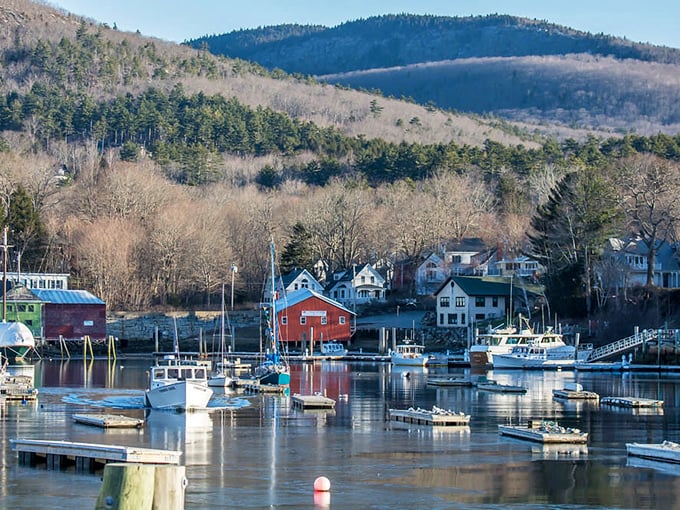 Camden: Where nature and charm collide! Boats bob gently in the harbor while mountains stand guard, creating a postcard-perfect scene.