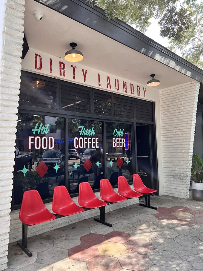 Red chairs and neon signs? It's like 'Happy Days' meets 'Mad Men' out here. Step inside for a spin cycle of fun!