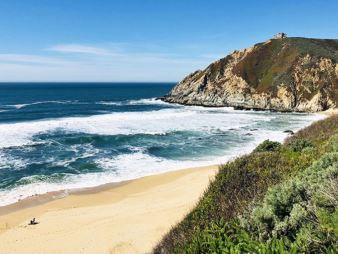 Nature's own amphitheater! Gray Whale Cove's cliffs cradle a golden crescent of sand, inviting beachgoers to a front-row seat for the Pacific's daily performance.